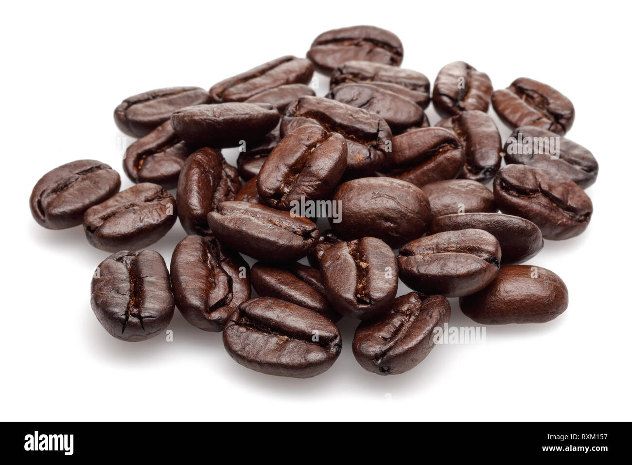 Dark roasted coffee beans isolated on white background Stock Photo - Alamy