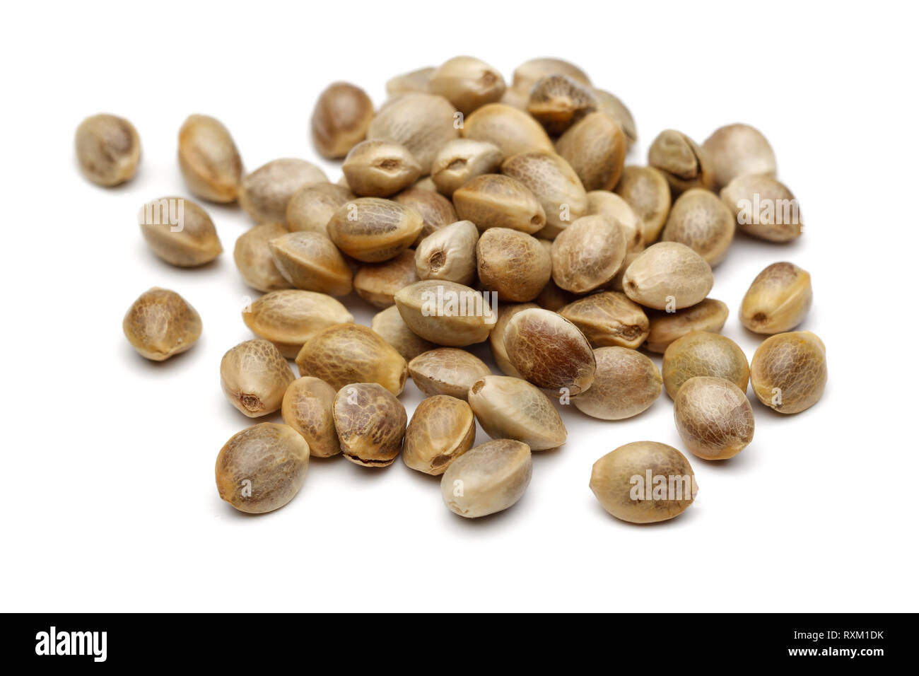 Heap of dry hemp seeds isolated on white background Stock Photo - Alamy