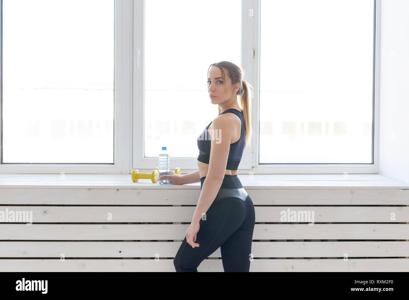 Workout, fitness and sport concept - pretty sporty woman standing near ...