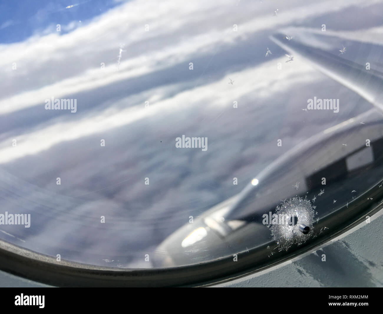 A detail of a small hole in plane´s window. It is used for pressure ...