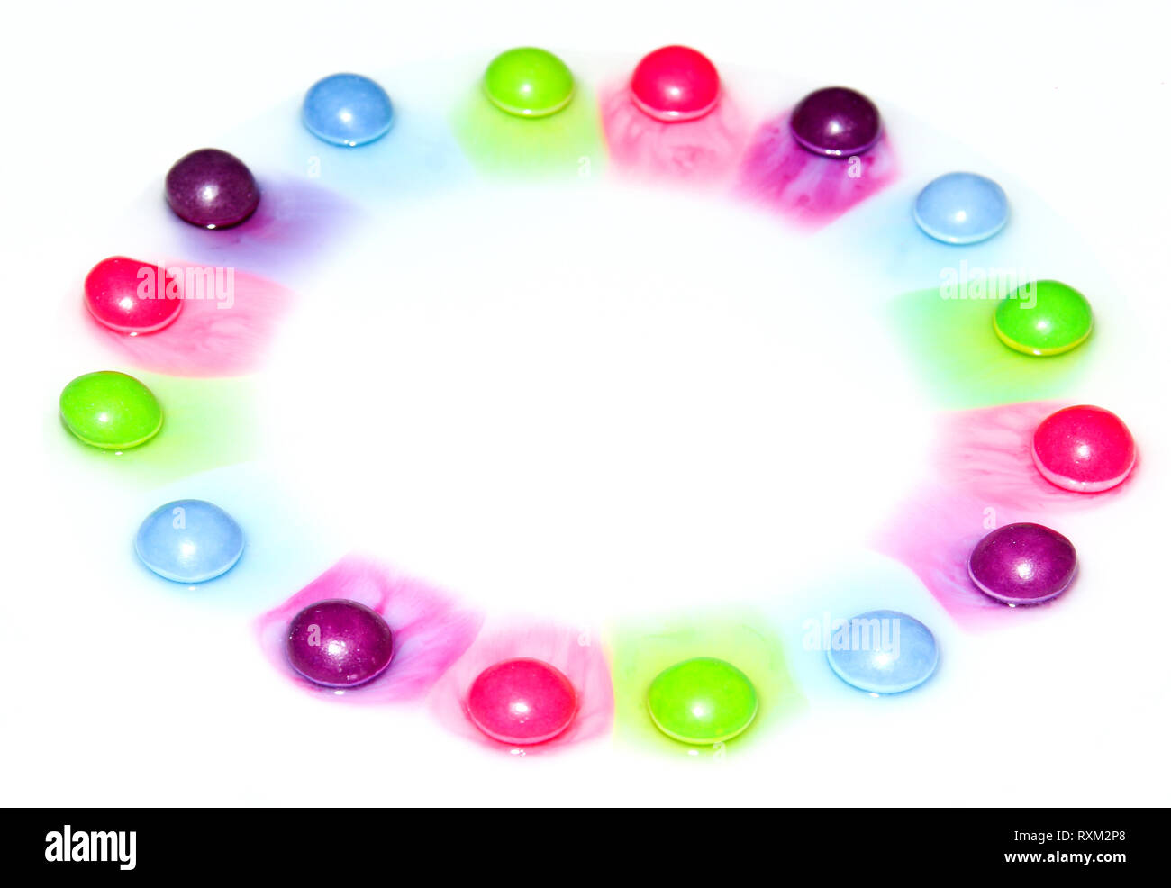 The candies are dissolving in the water and are making a colorful show ...