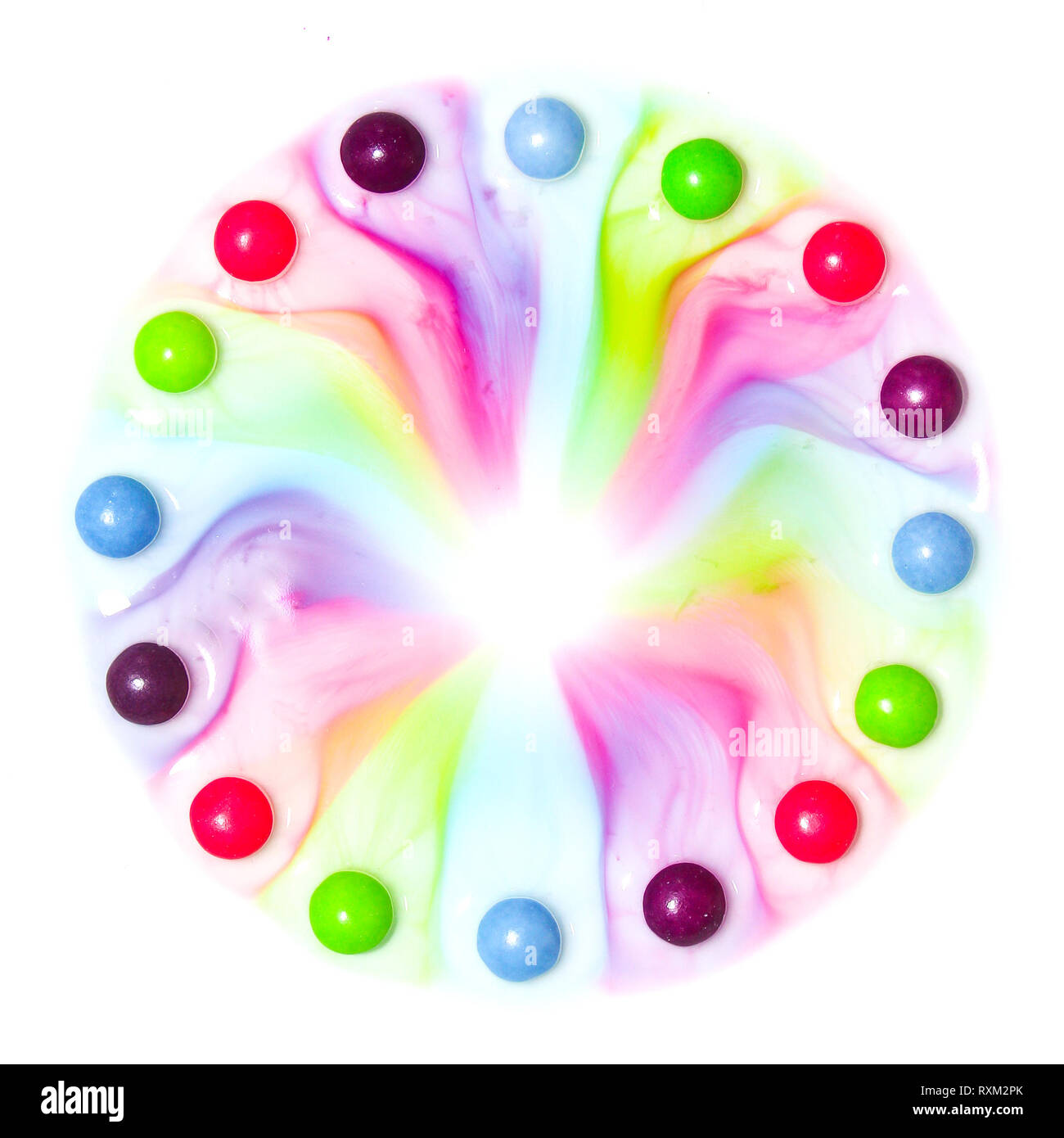 The candies are dissolving in the water and are making a colorful show ...