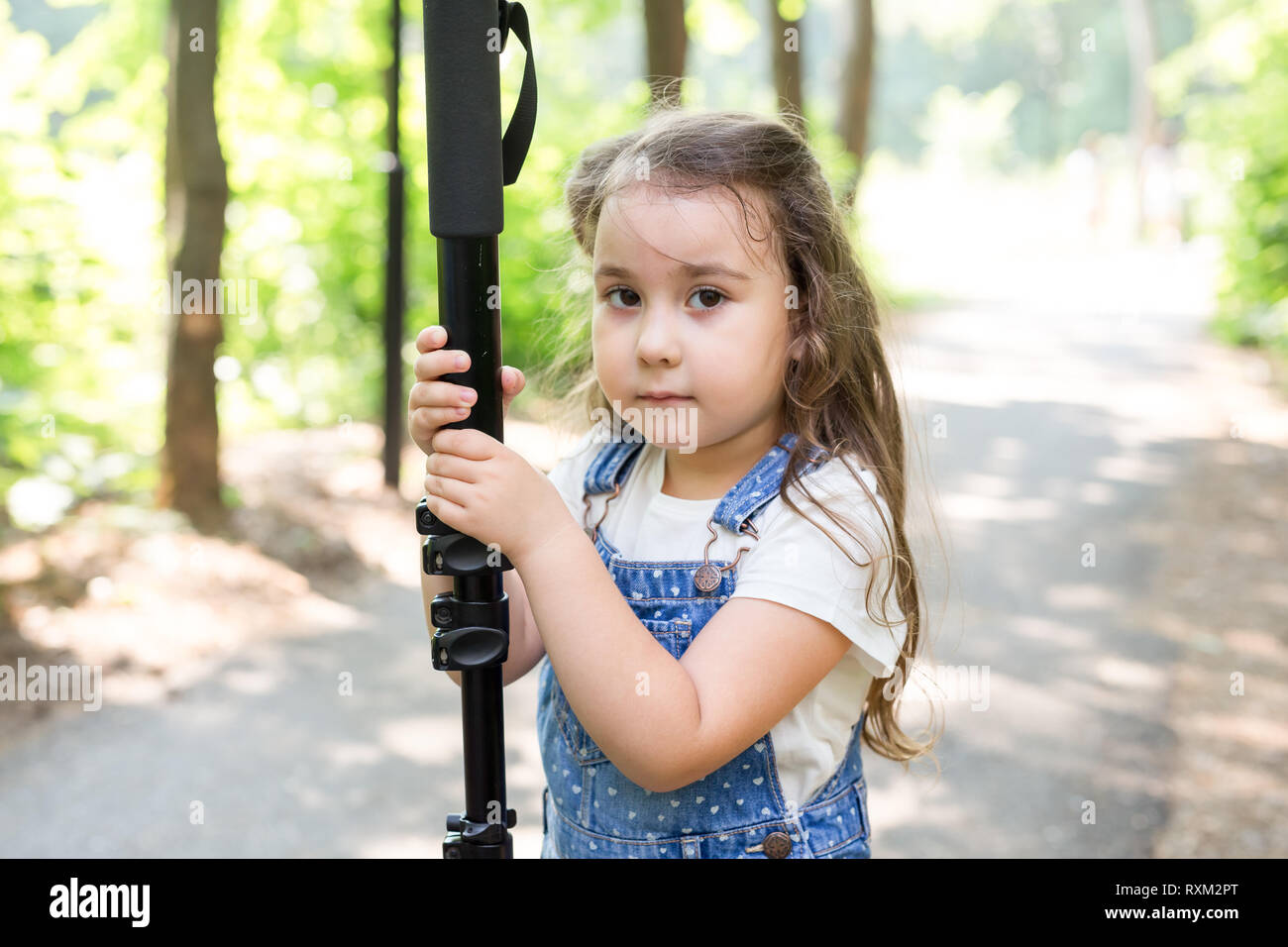 Hobby, children and photographer concept - child with camera in forest ...