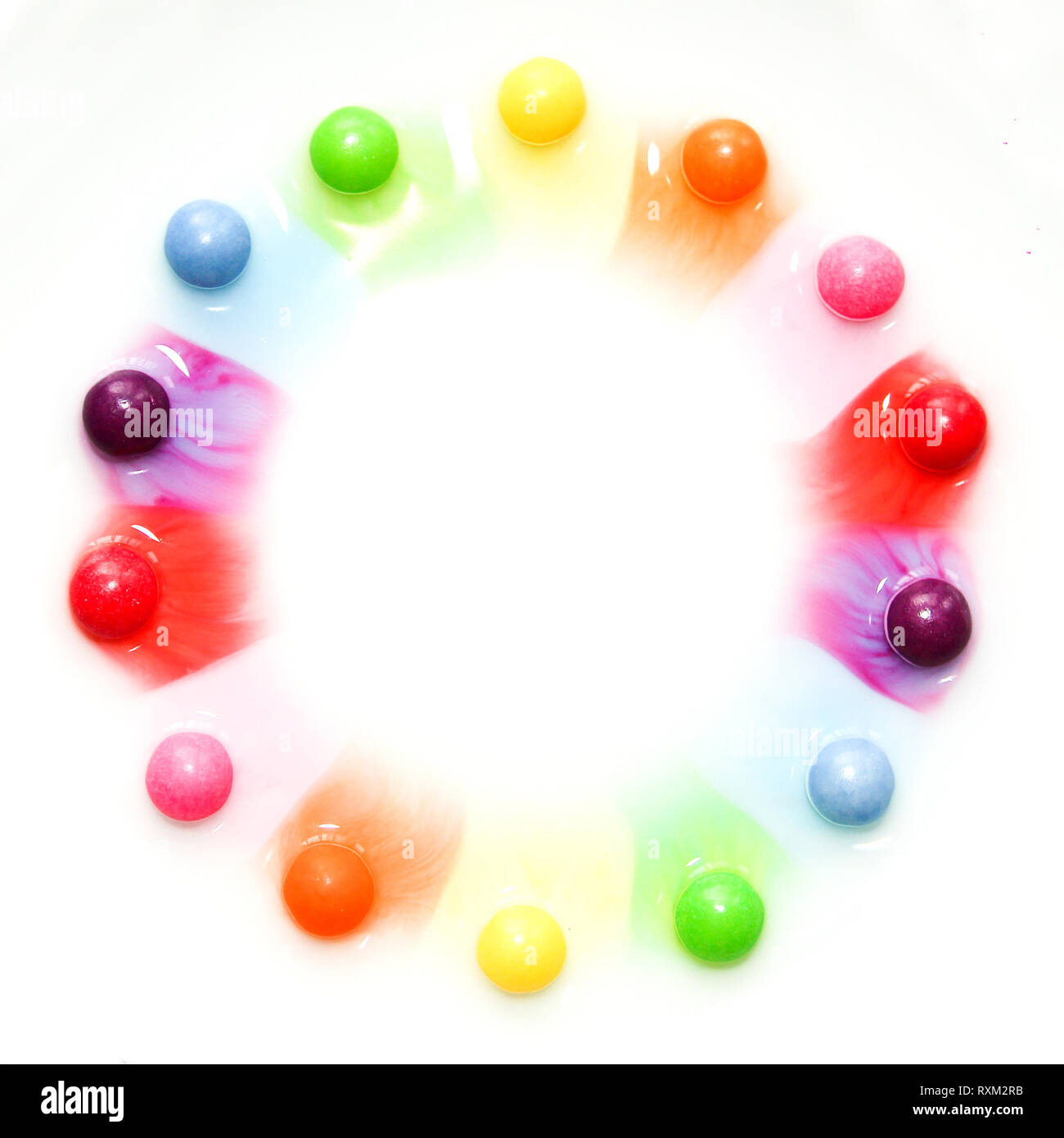 The candies are dissolving in the water and are making a colorful show ...