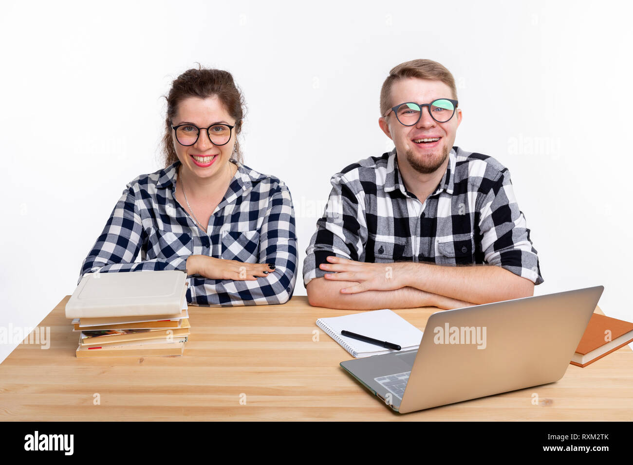 Education, students, people concept - funny couple of teens in glasses ...