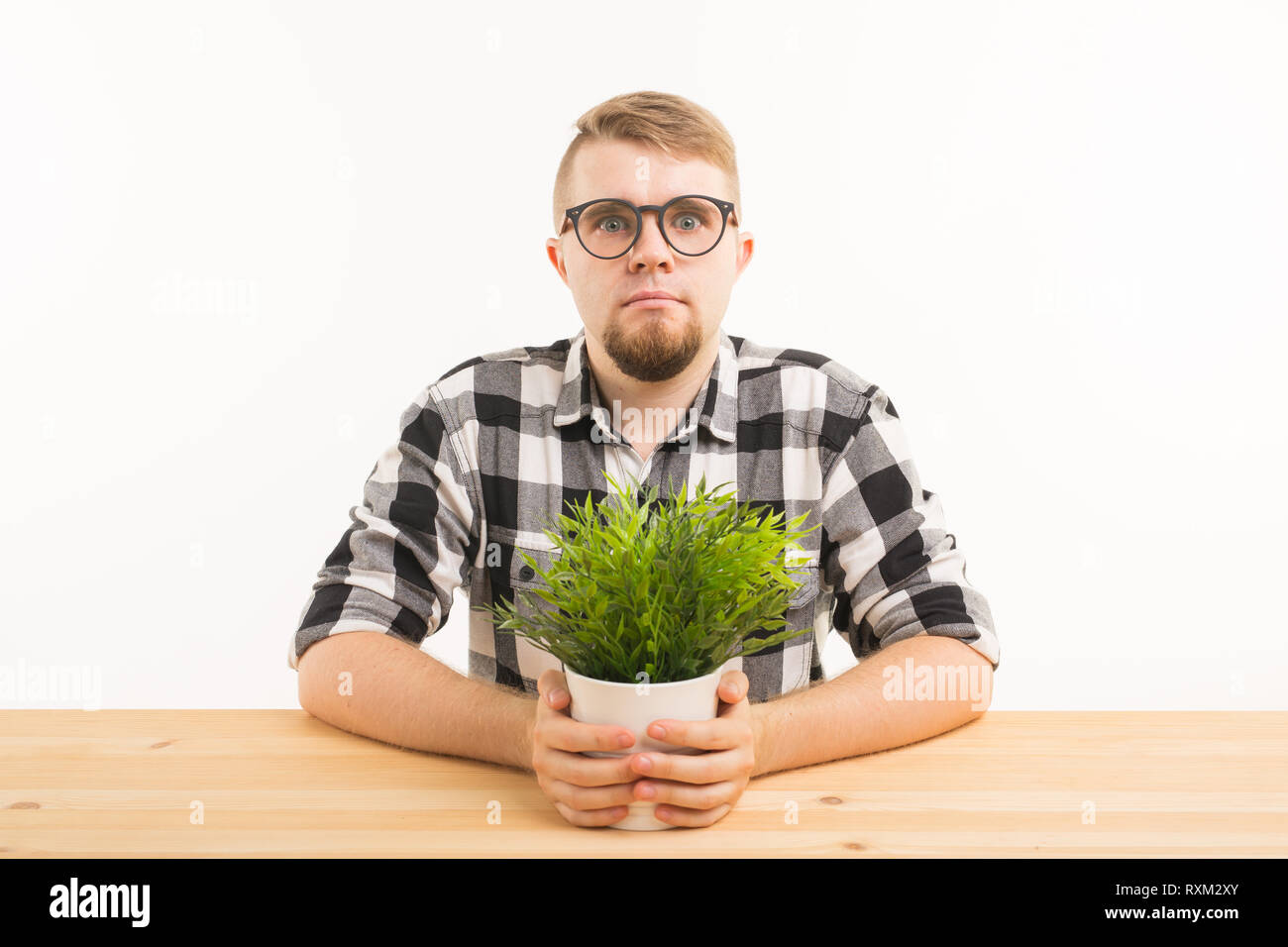 Student, office and people concept - a young grumpy man sitting at the ...