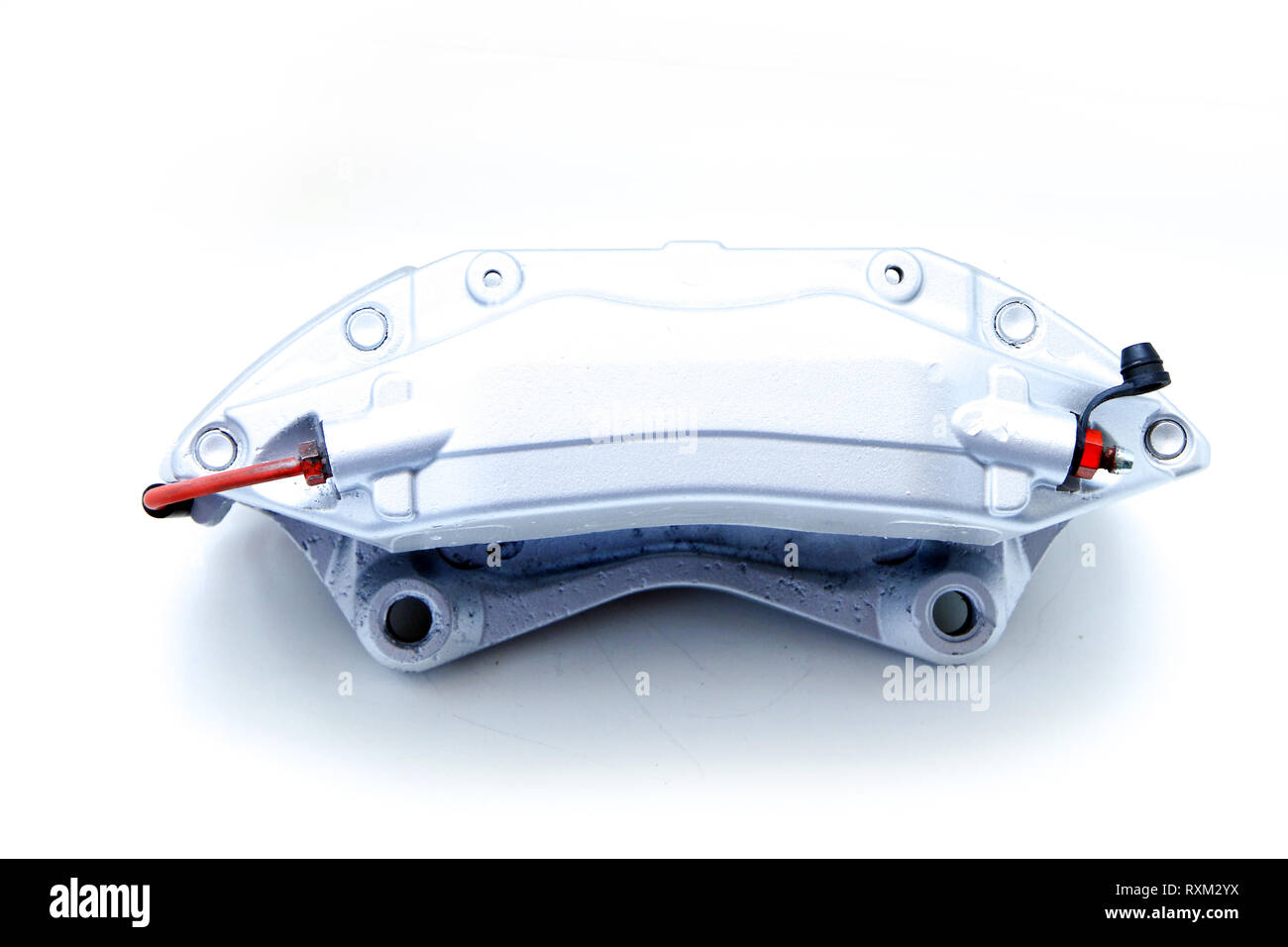 Silver four piston sports brake calliper isolated on a white background ...