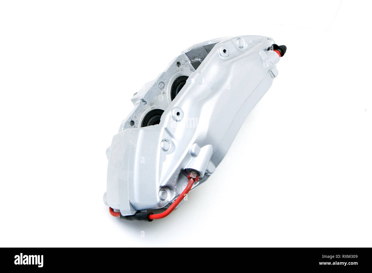 Silver four piston sports brake calliper isolated on a white background ...