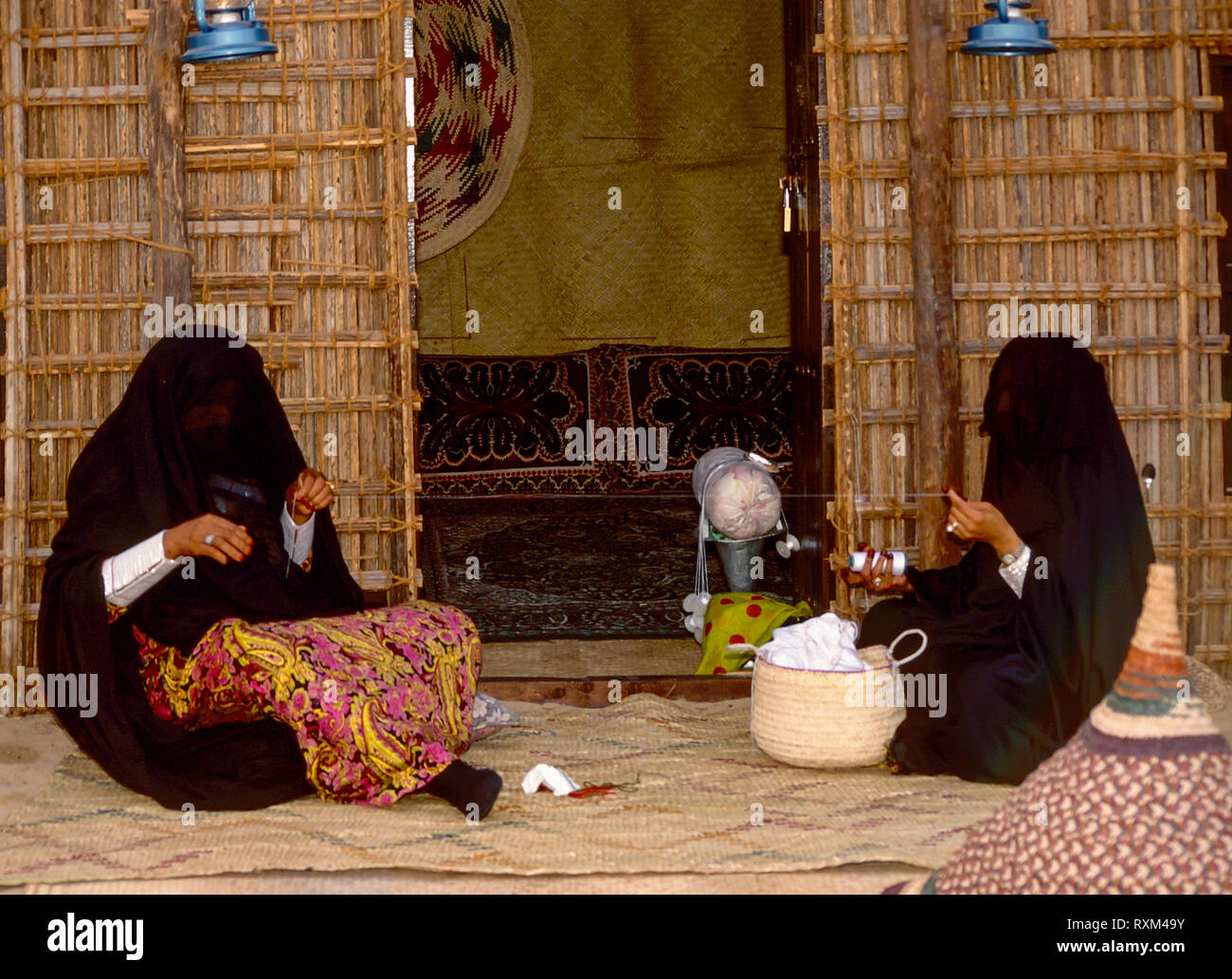 Arab folklore and history with Emirati Bedouin women demonstrating the ...
