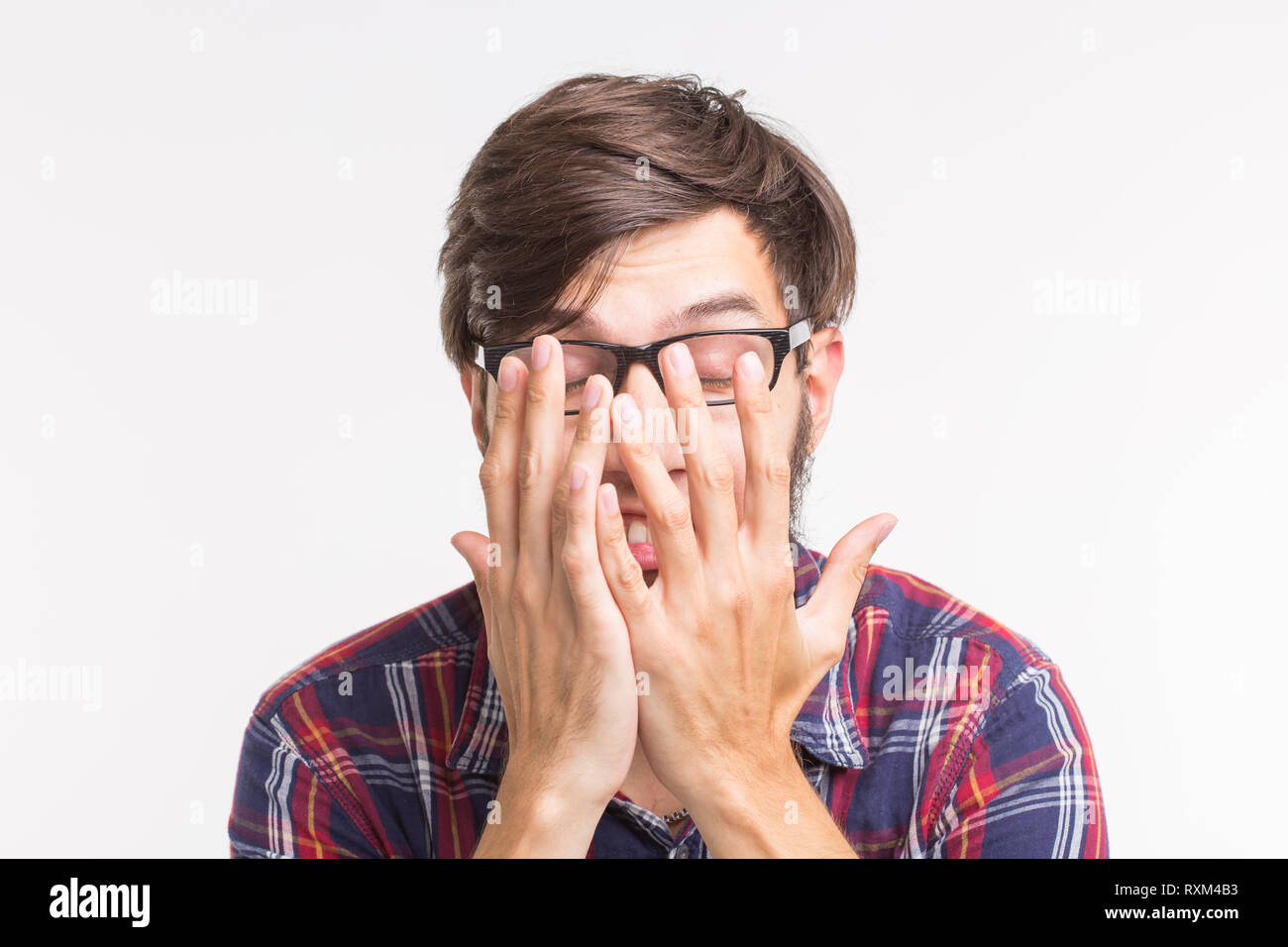 people, feelings and gesture concept - scared man hiding behind his ...