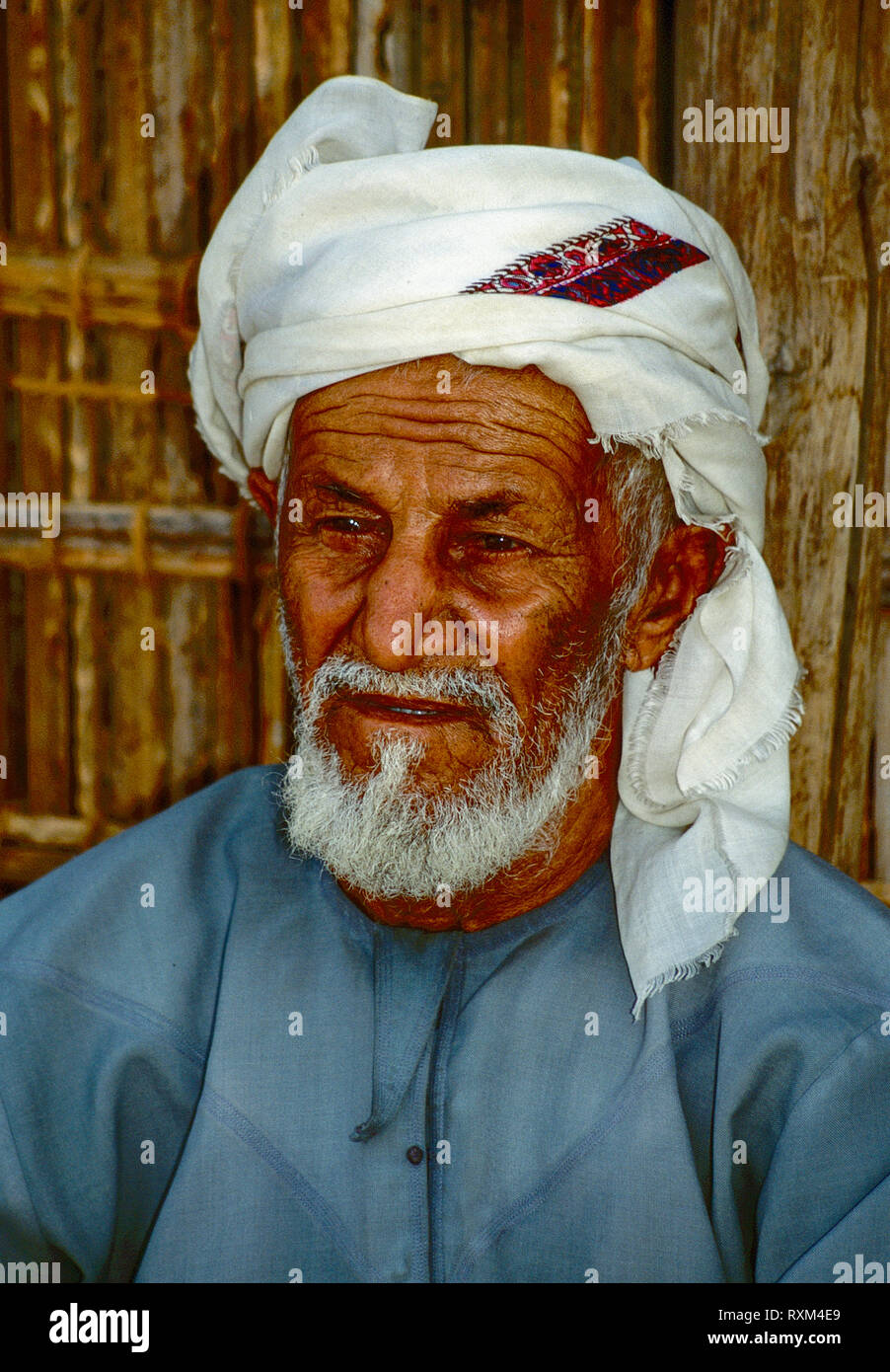 Arab folklore and history with elderly Emirati man resting and posing ...
