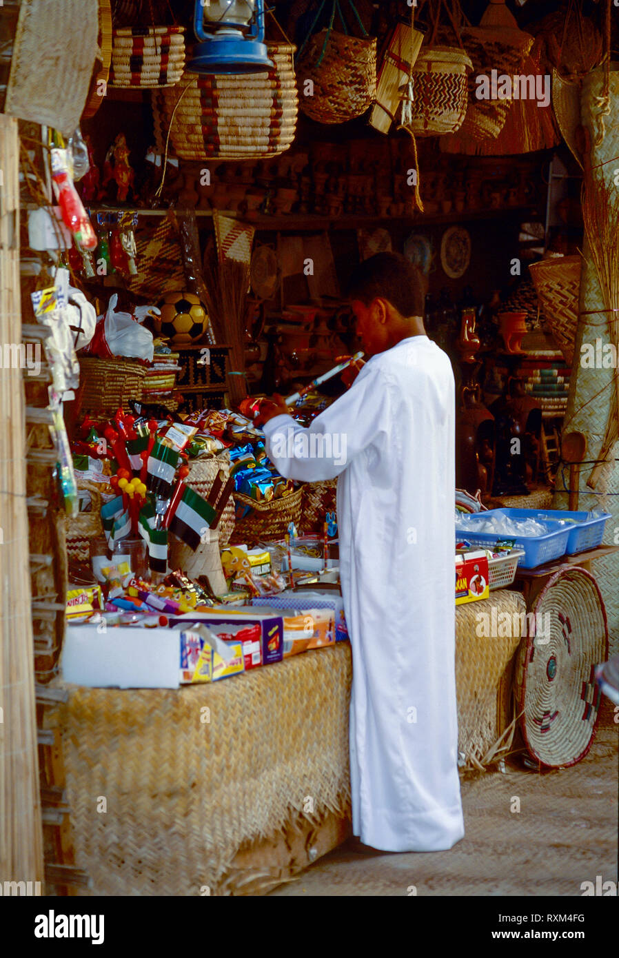 Arab folklore and history with a young man shopping during the Dubai ...