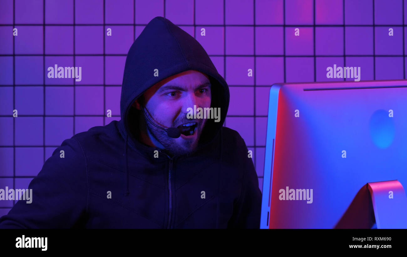 Gamer Giving Commands into Microphone. He Plays in Multiplayer Video ...