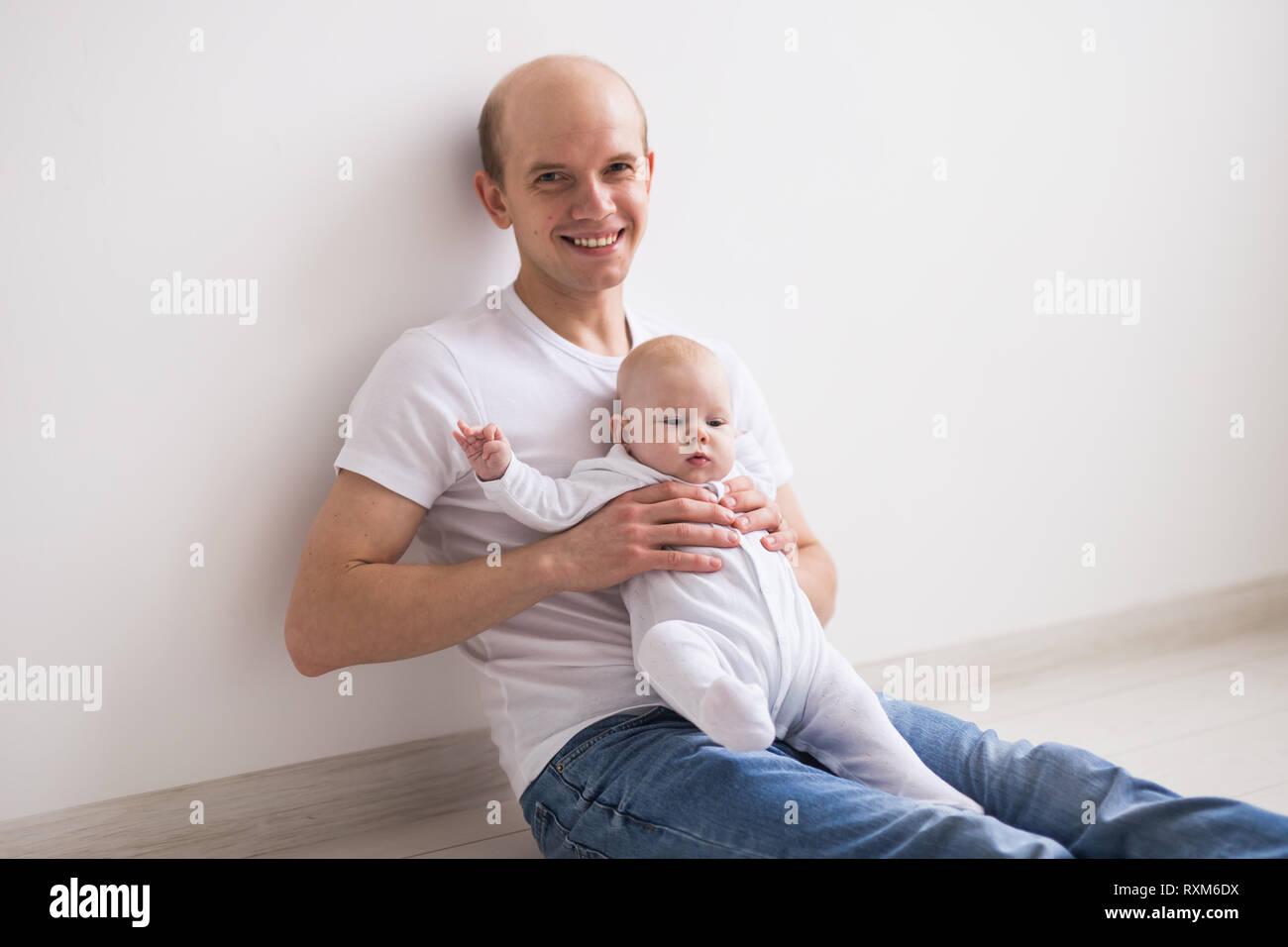 Children, family and fatherhood concept - happy bald father holding ...
