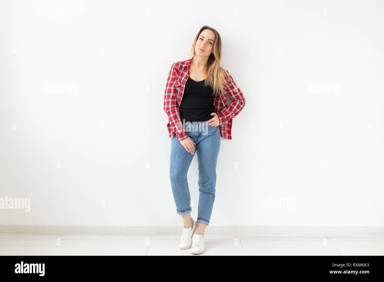 People and fashion concept - Full length image of woman posing sideways ...