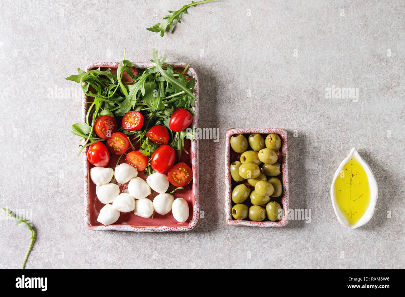 Mozzarella tomatoes olives antipasto Stock Photo - Alamy