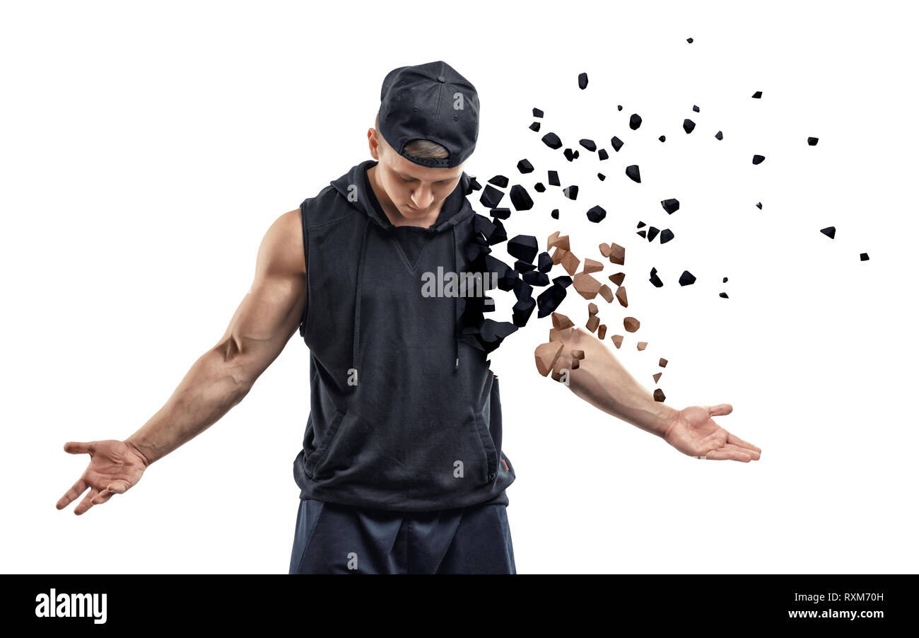 Young muscular man in black sport clothing shattering into small pieces ...