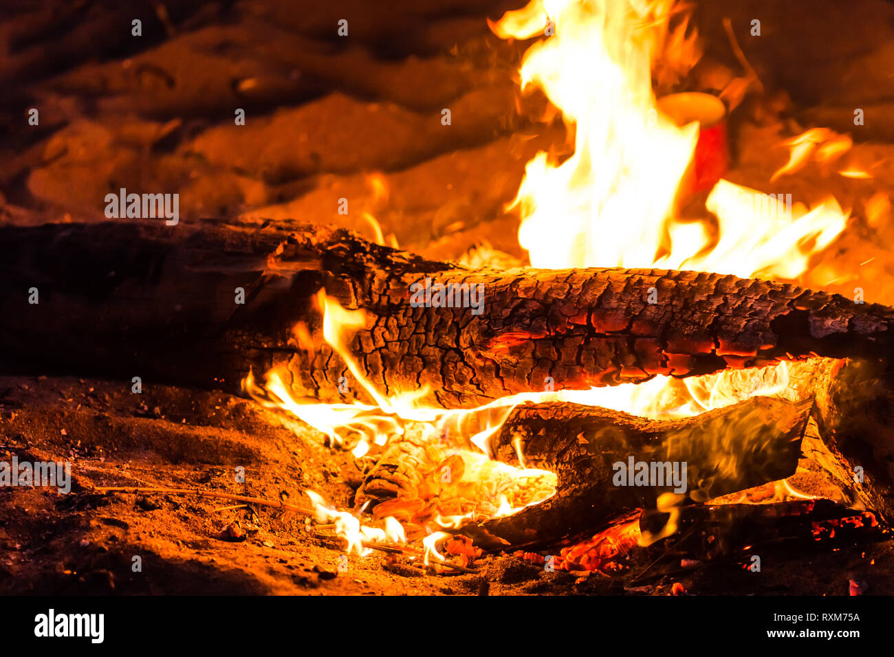 Night, tourism and nature concept - burning log and fire Stock Photo ...