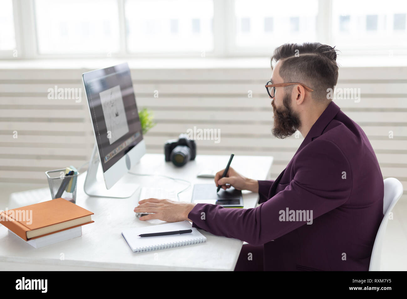 people, design and style concept - graphic designer sketching new ...