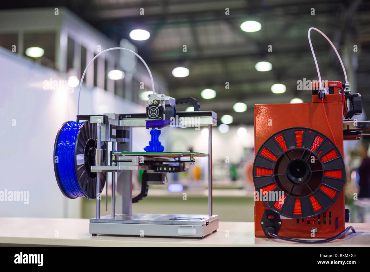 Three dimensional printing machine prints physical 3D model Stock Photo ...