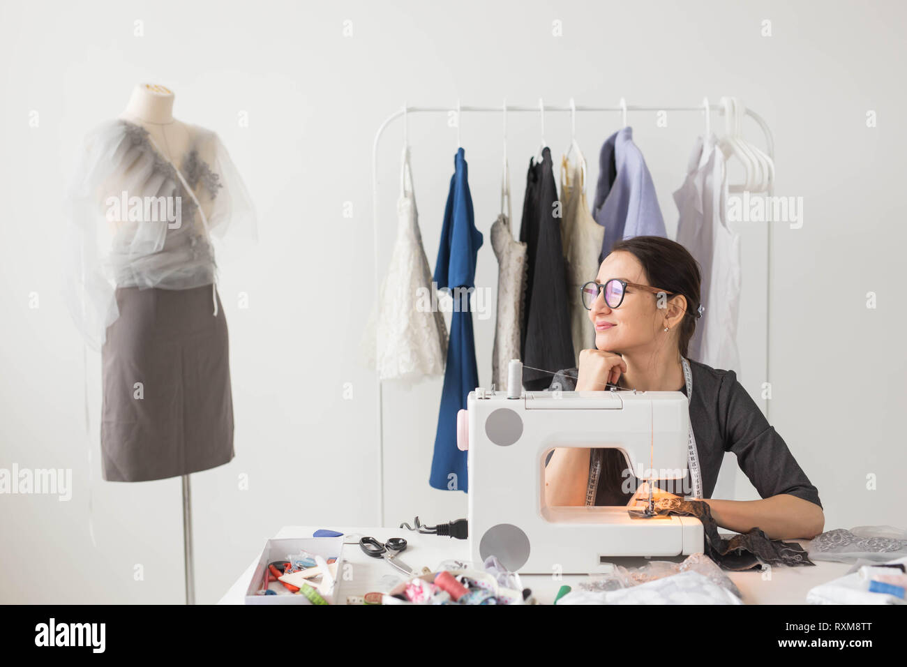 Dressmaker, tailor and fashion concept - Smiling female fashion ...