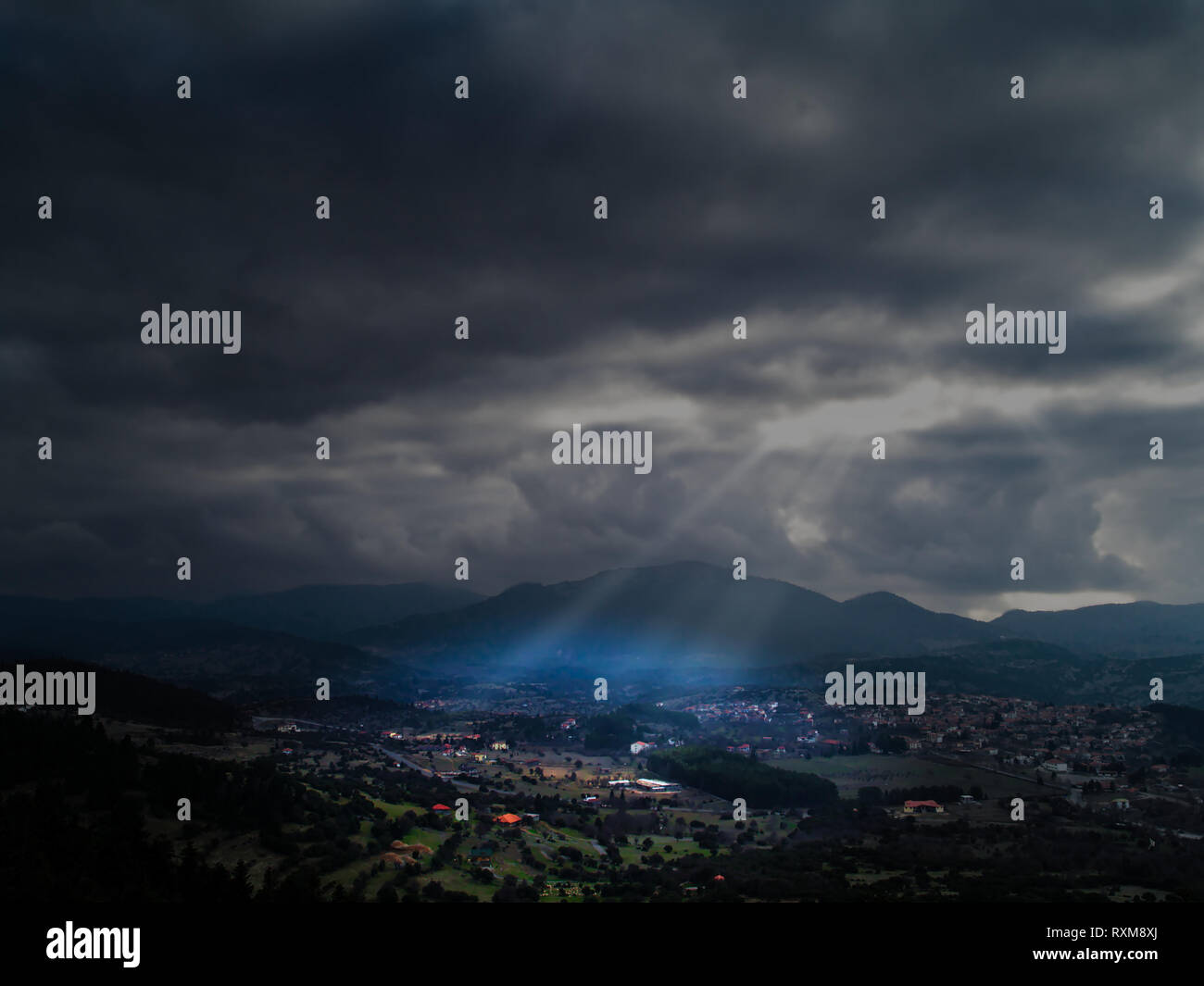 Sun rays through the clouds mountains and valley , in Arcadia Greece ...