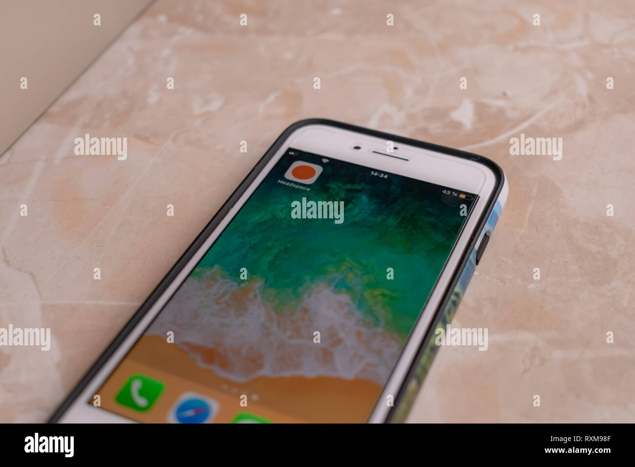 Photo covering most of mobile smartphone, showcasing headspace app in ...