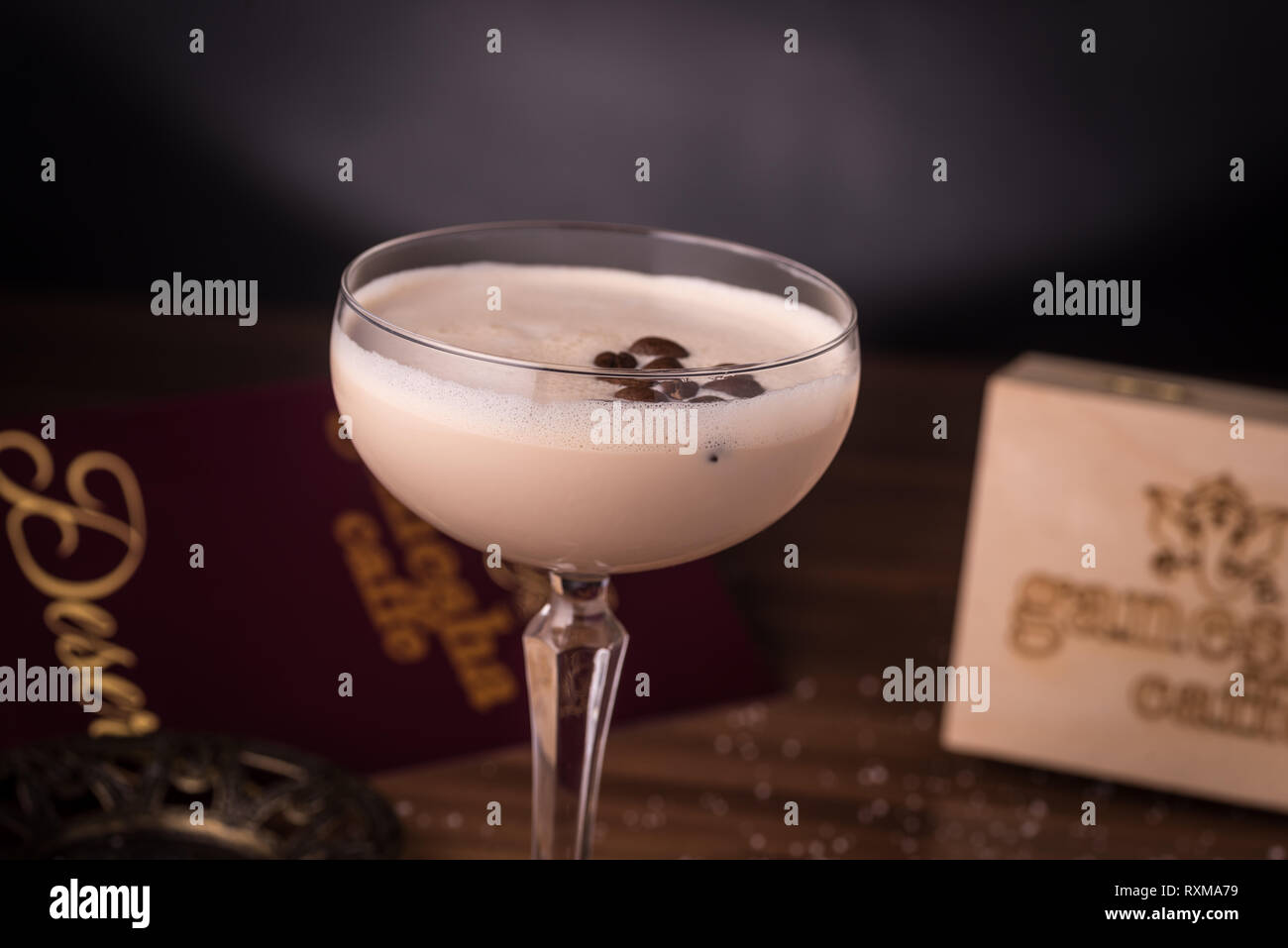 Colour Cocktail on dark wooden background Stock Photo - Alamy