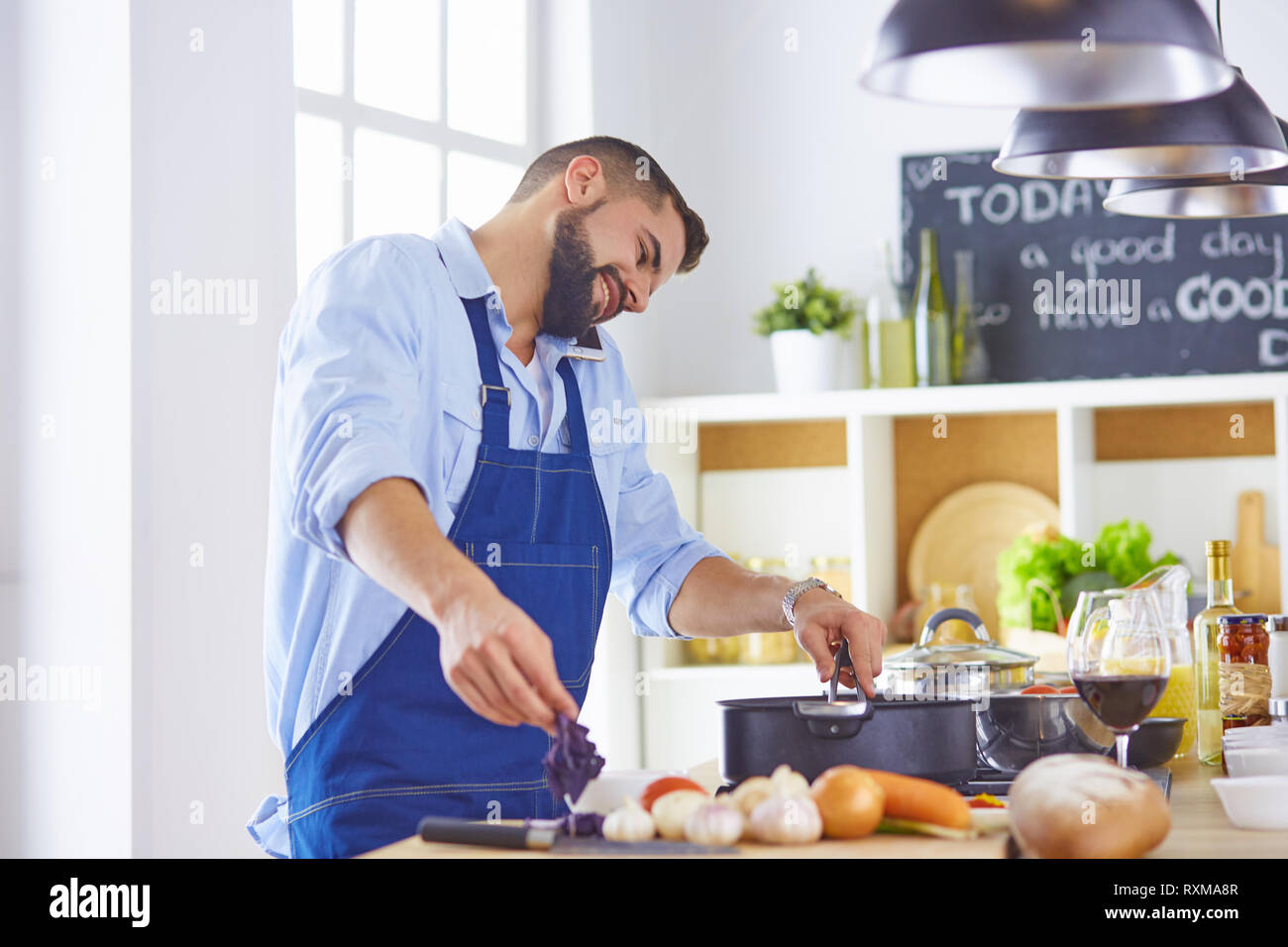 cooking, profession and people concept - male chef cook with smartphone ...