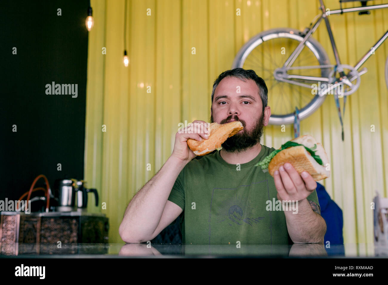 The hungry man who eats a sandwich Stock Photo - Alamy