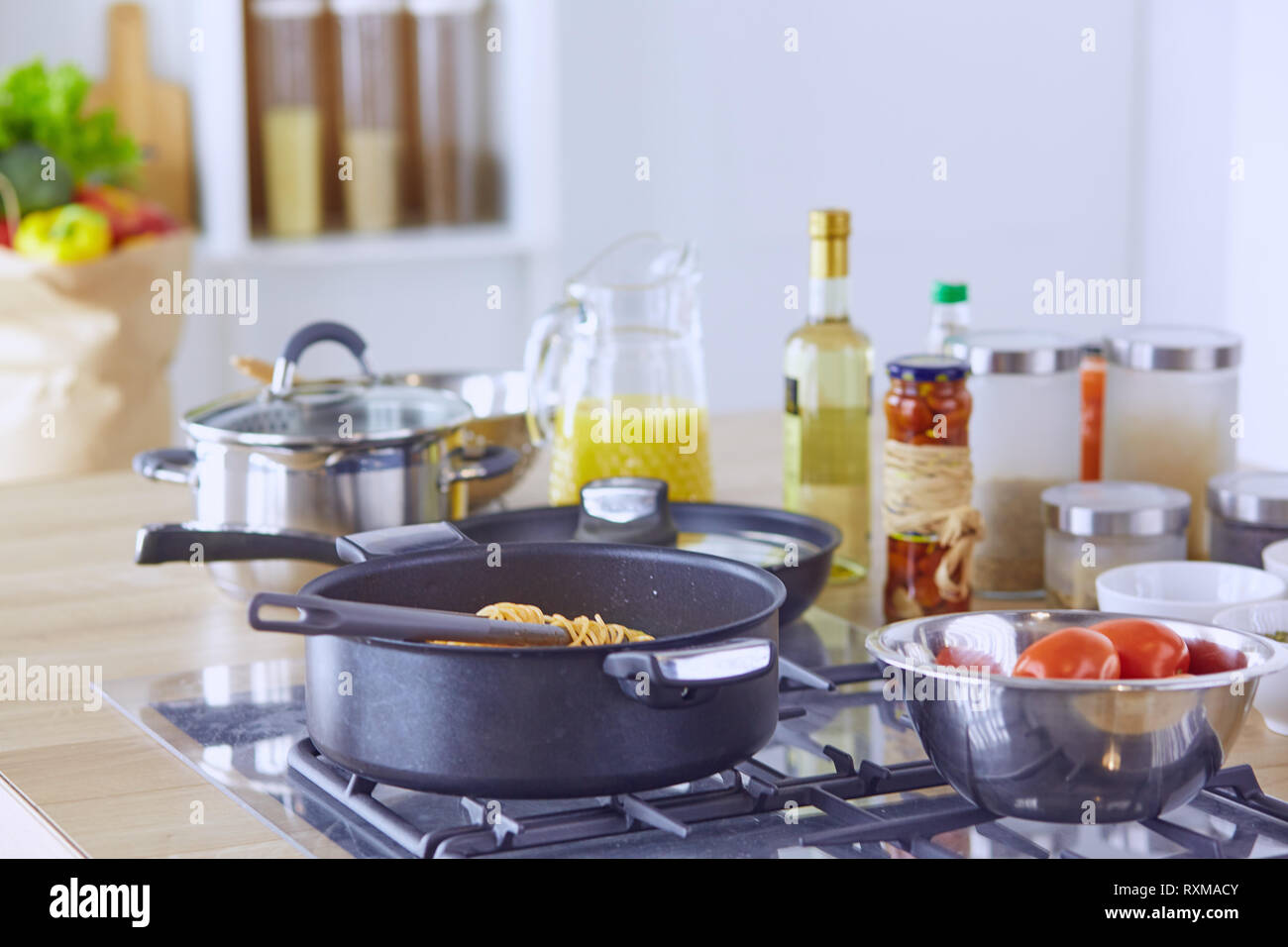 Composition with wooden board and ingredients for cooking on table ...