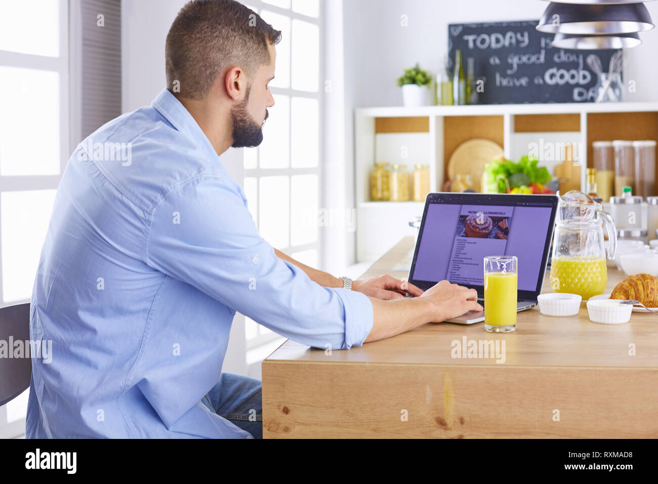 a business man breakfasts with notebook and juice Stock Photo - Alamy