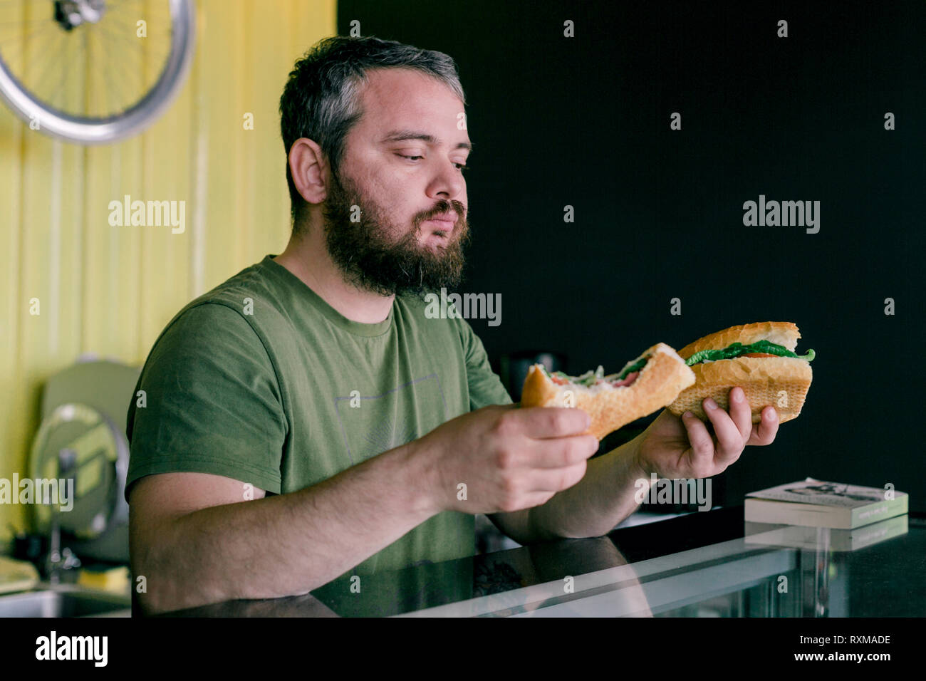 The hungry man who eats a sandwich Stock Photo - Alamy