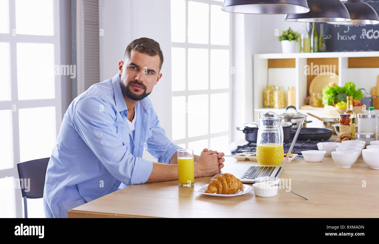 a business man breakfasts with notebook and juice Stock Photo - Alamy