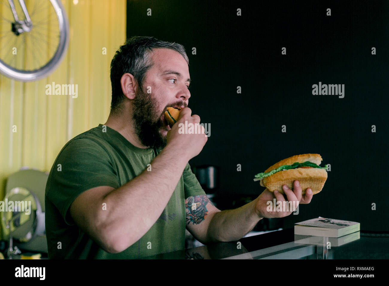 The hungry man who eats a sandwich Stock Photo - Alamy