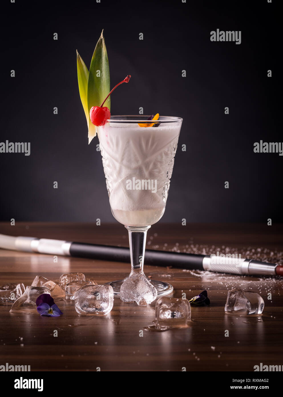 Colour Cocktail on dark wooden background Stock Photo - Alamy