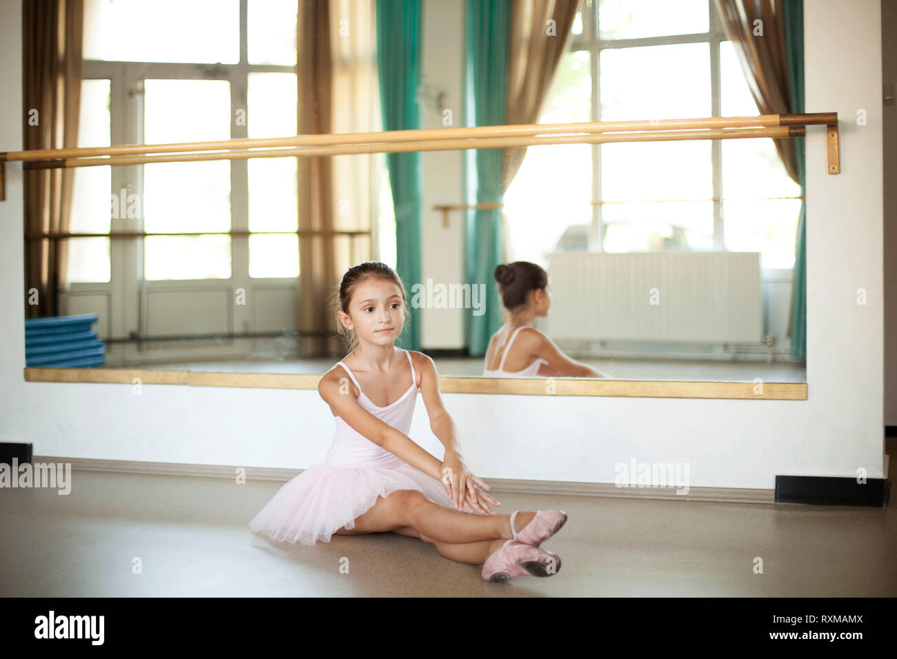 Little ballerina in ballet studio Stock Photo - Alamy