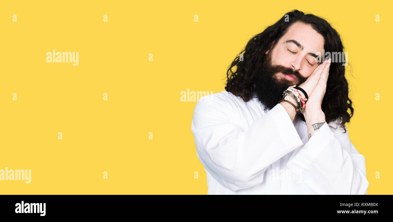 Man wearing Jesus Christ costume sleeping tired dreaming and posing ...