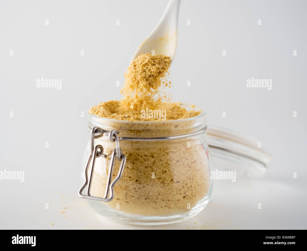 Nutritional yeast background. Nutritional inactive yeast falling from ...