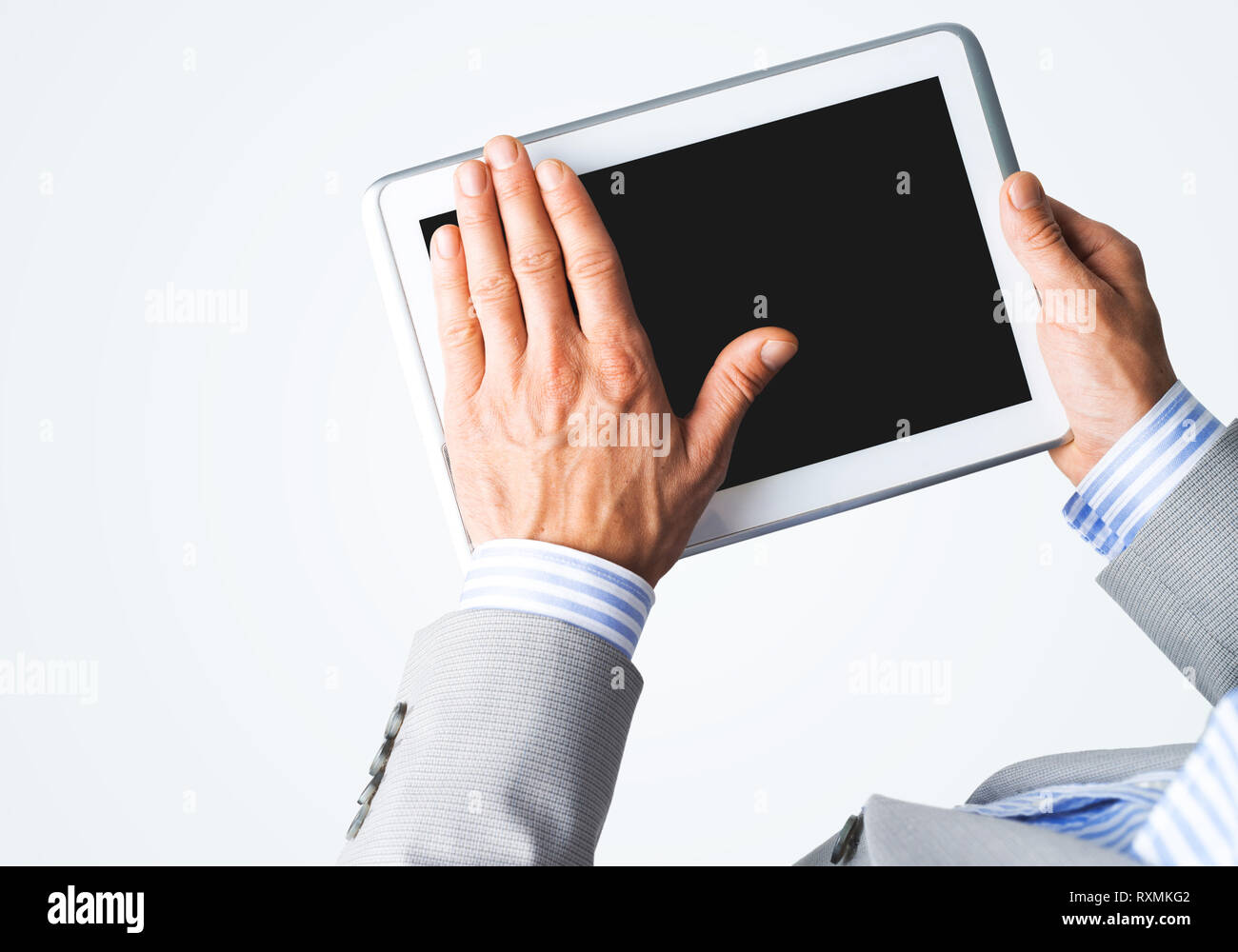 Hands of businessman holding tablet pc with black screen Stock Photo ...