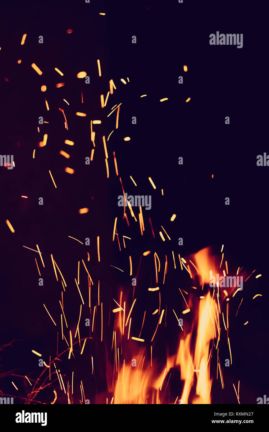 Night bonfire with sparks background. Vertical composition Stock Photo ...