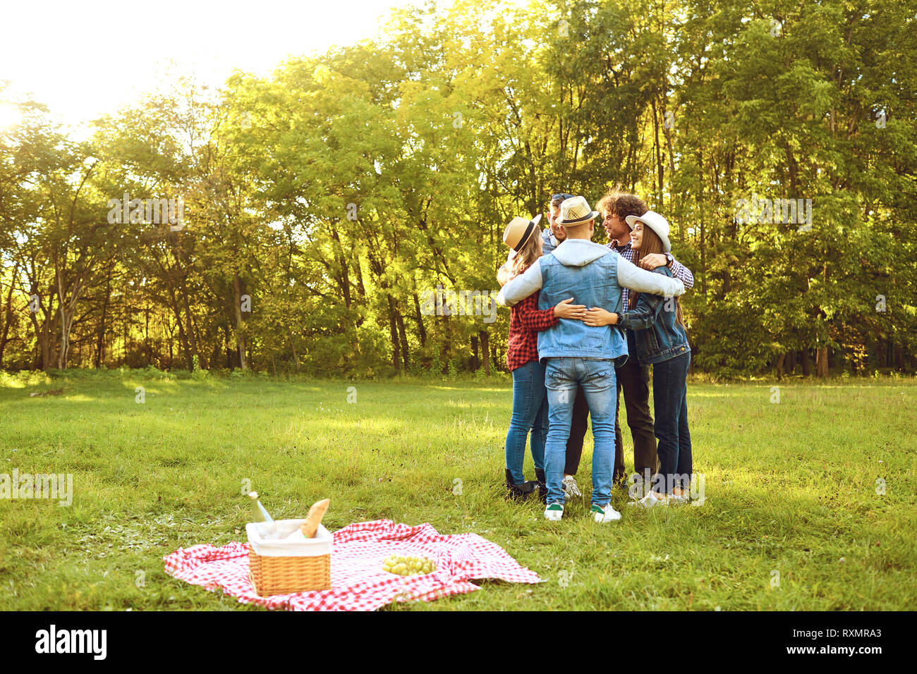 Friends standing together and hugging hi-res stock photography and ...