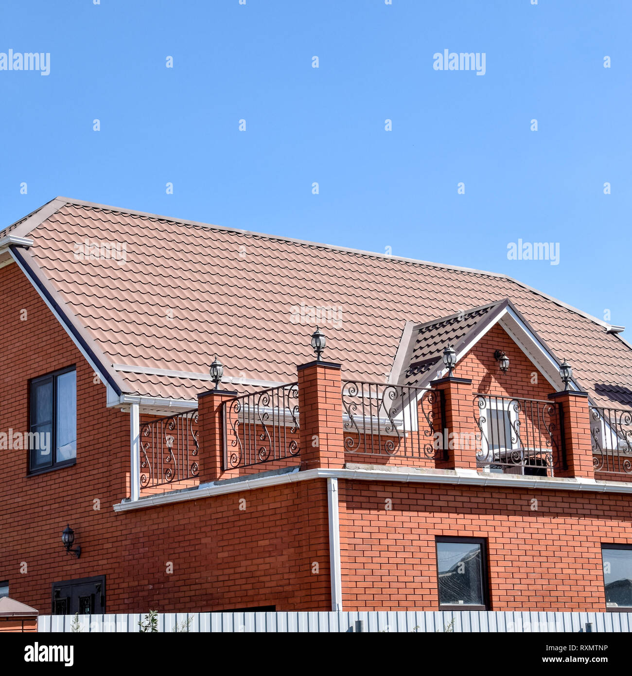 Detached house with a roof made of steel sheets. Roof metal sheets ...