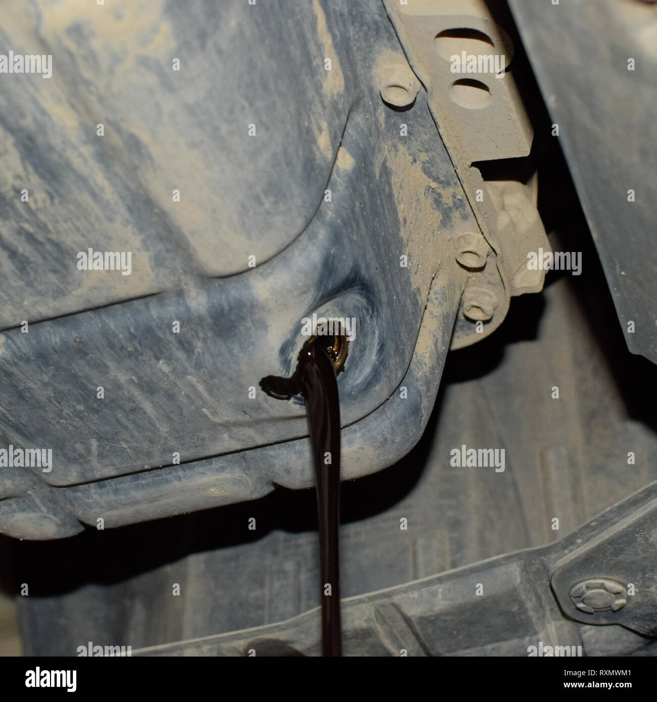 Drain the old oil from the engine through the drain plug. Changing the ...