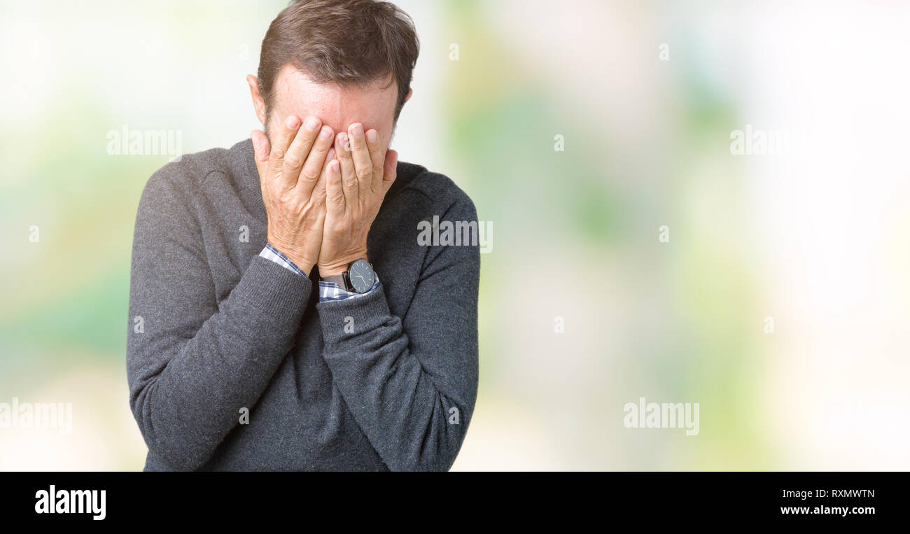 Handsome middle age senior man wearing a sweater over isolated ...