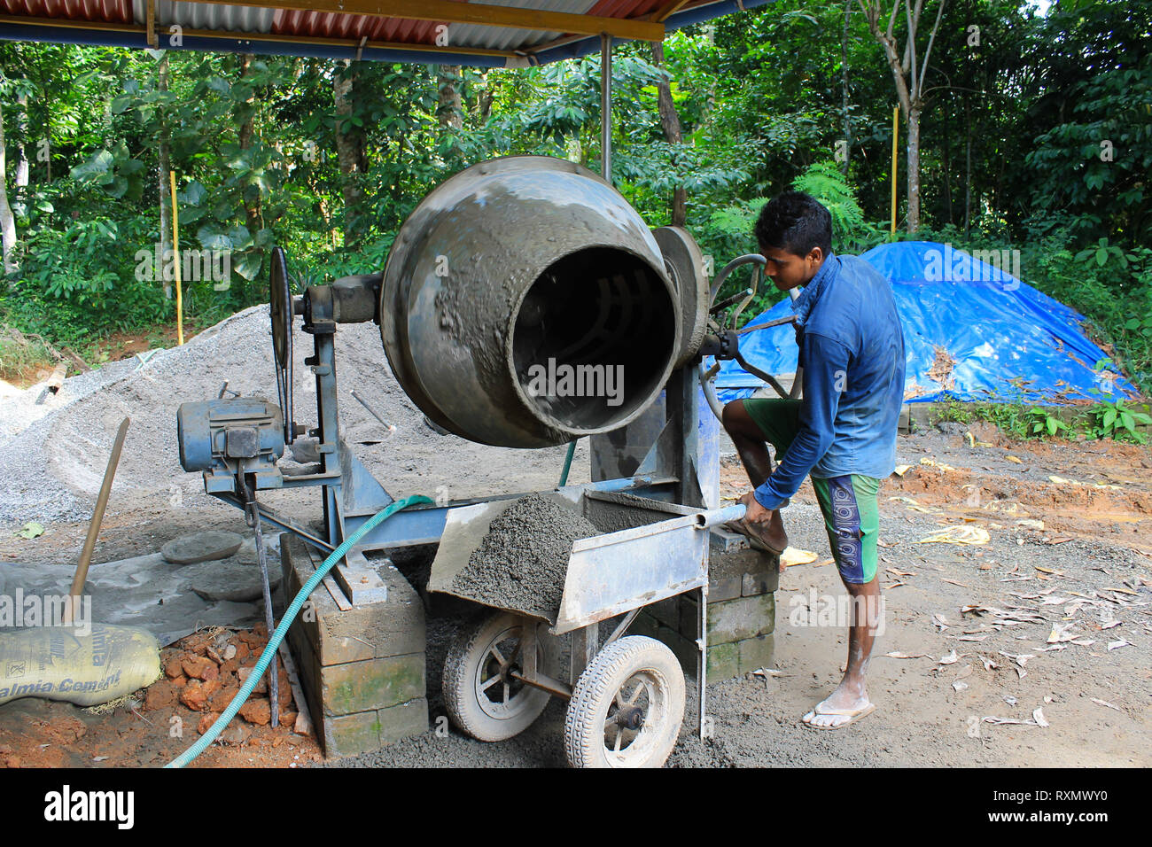 Worker mixing cement making construction hi-res stock photography and ...