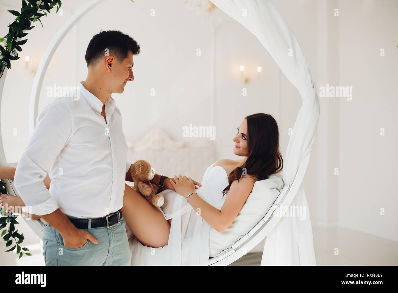 Future parents touching belly and expecting little baby Stock Photo - Alamy