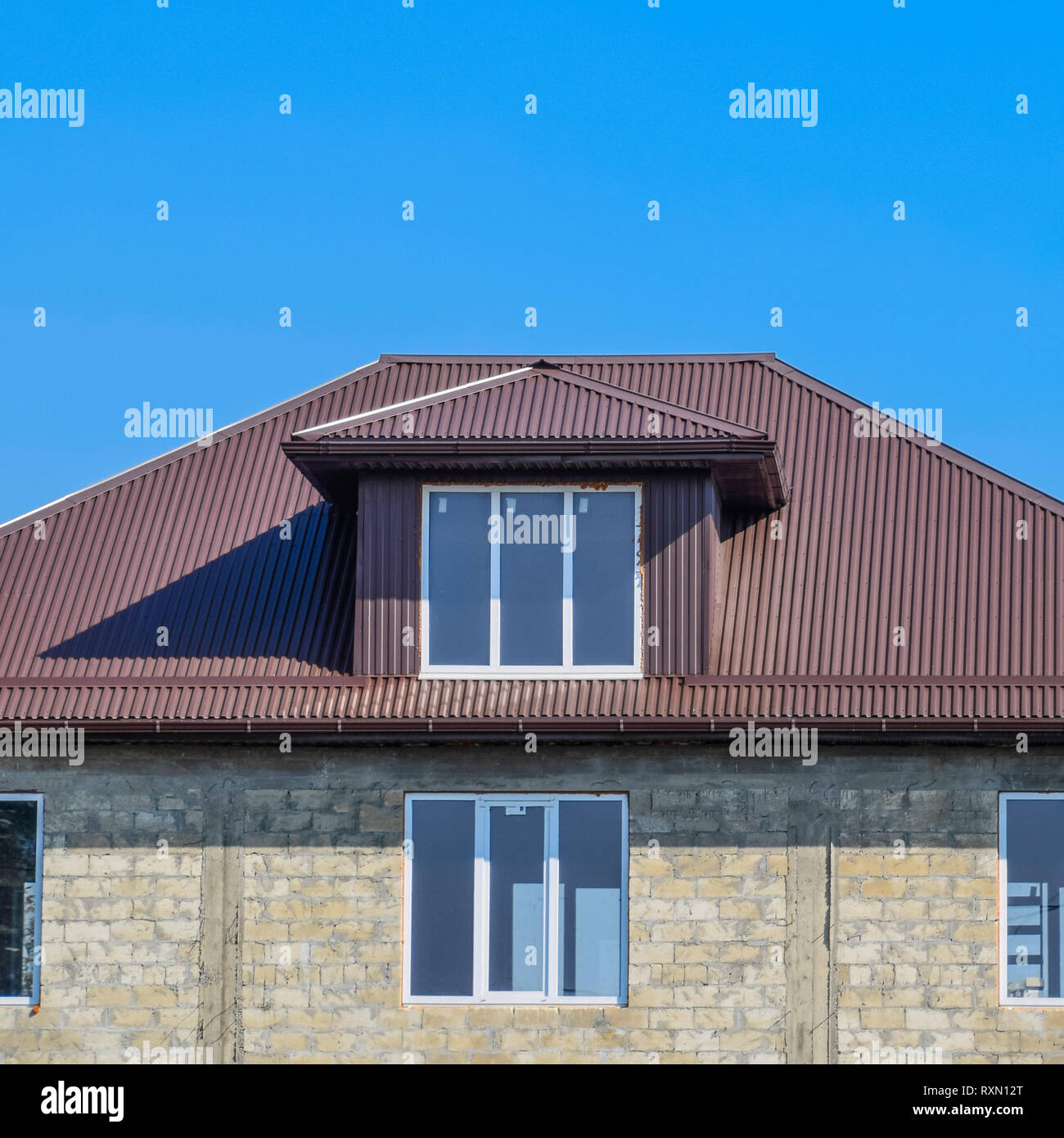 House of cinder block. The house with plastic windows and a roof of ...