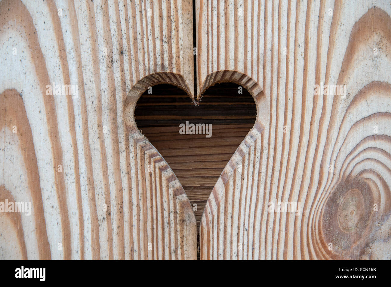 sawn out wooden heart in a toilet wooden door Stock Photo - Alamy