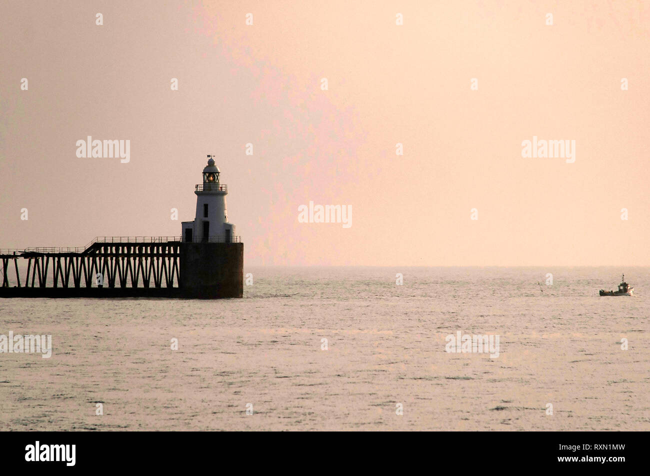 Sunrise at Blyth pier with fishing boat, Northumberland Stock Photo - Alamy